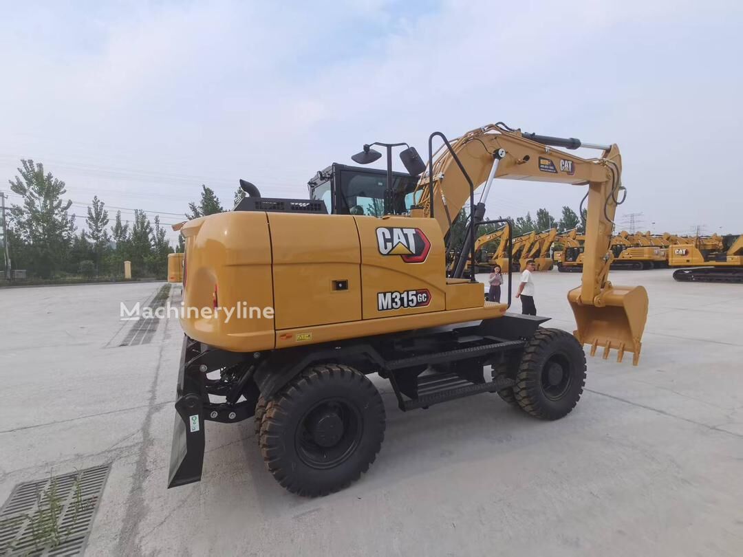 Caterpillar M-315 bager točkaš