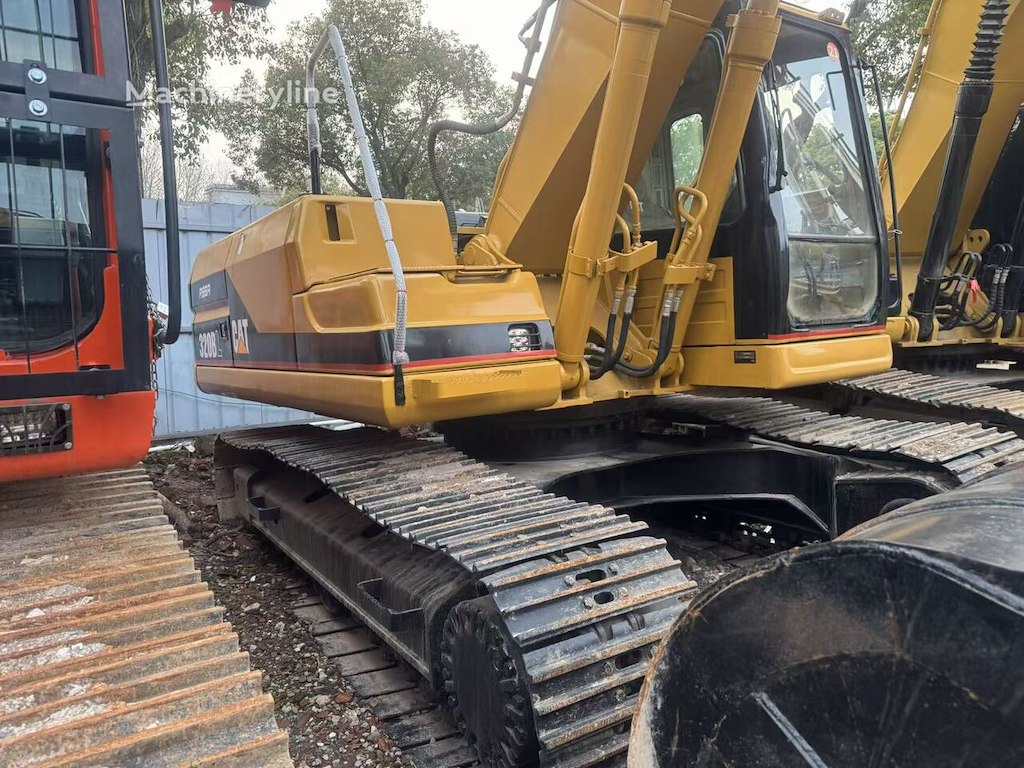 Caterpillar 320BL bager guseničar