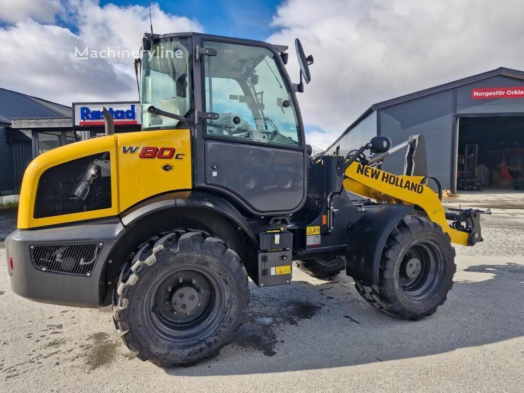 Prodaje se New Holland W80C multifunkcionalni utovarivač na aukciji