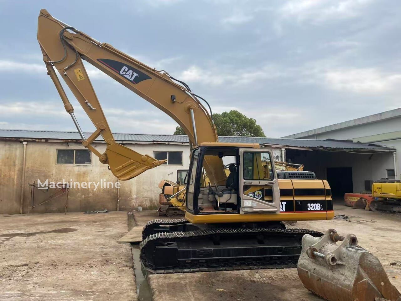 Caterpillar 320BL bager guseničar