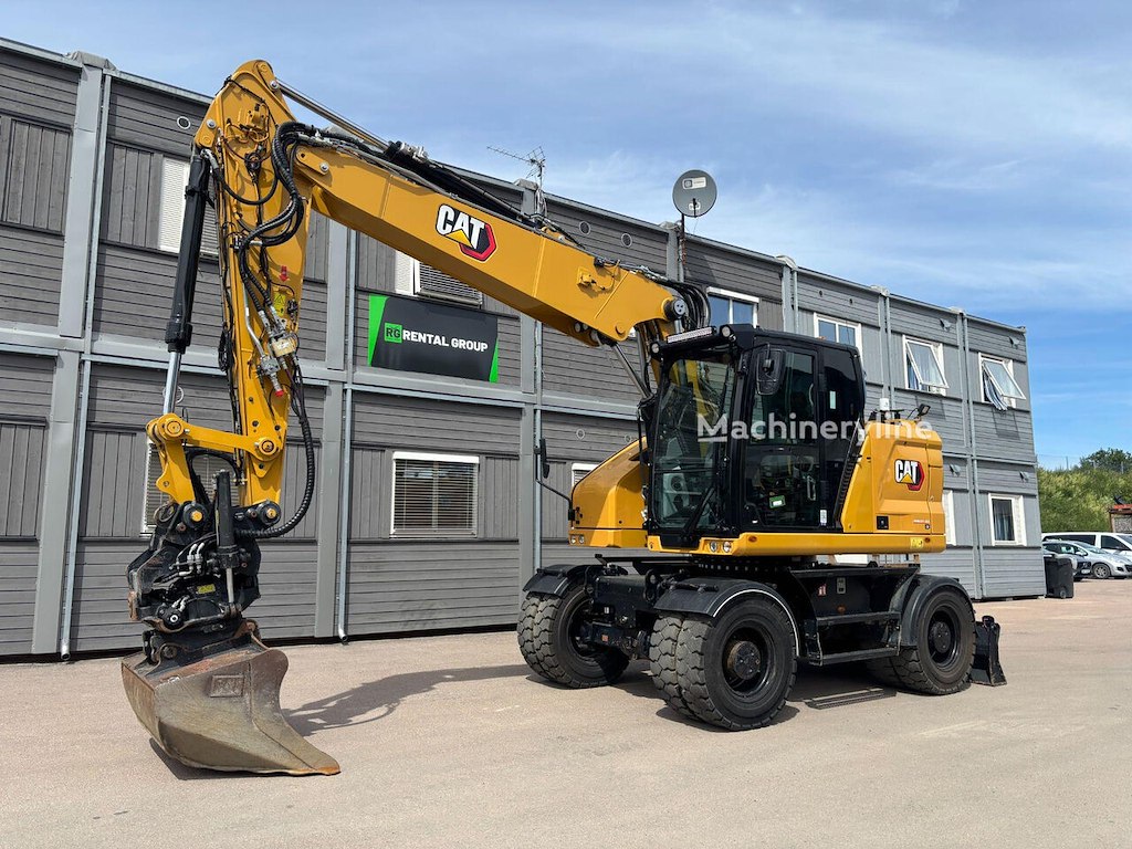 Caterpillar M317 bager točkaš