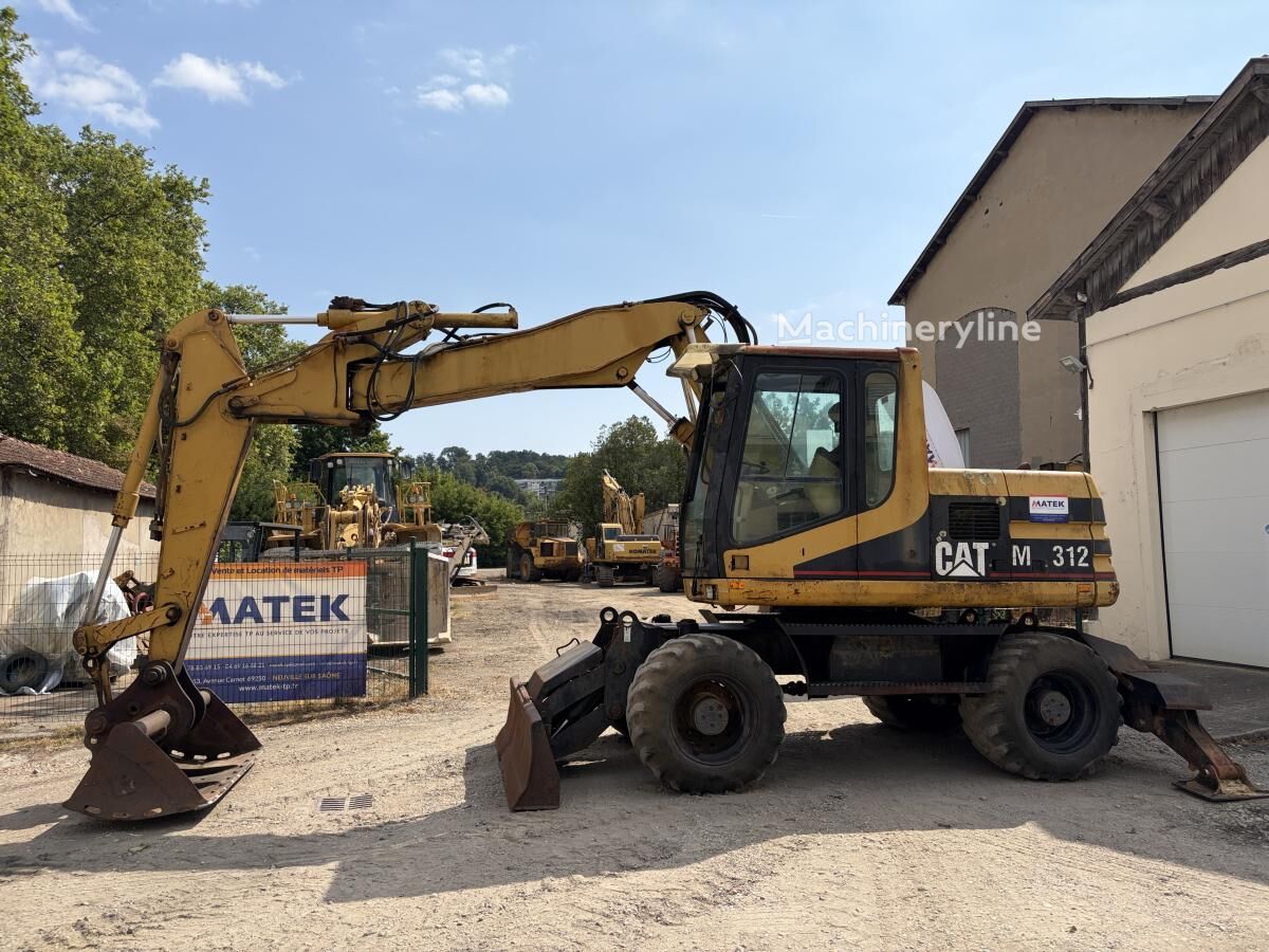 Caterpillar M312 bager točkaš