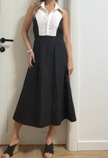    Elegantna crno-bela midi haljina