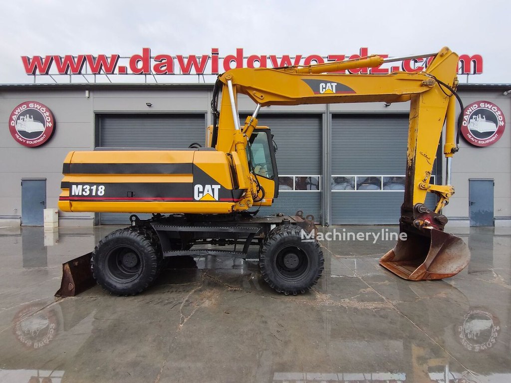 Caterpillar M318 bager točkaš