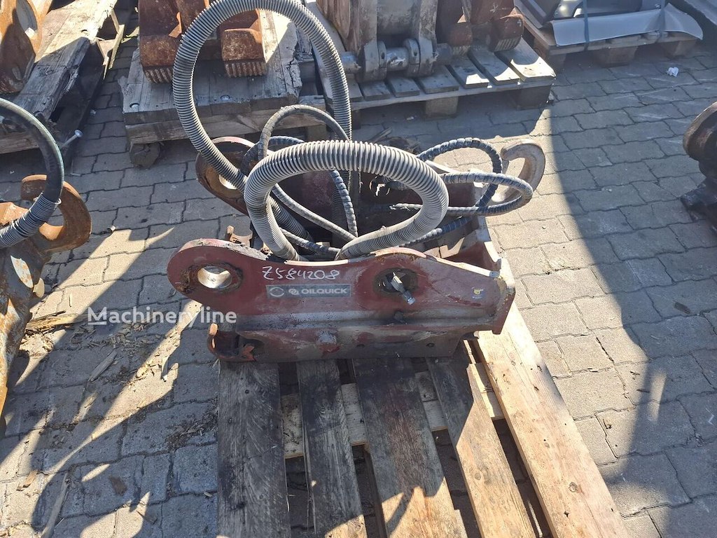 OilQuick OQ65 brza spojnica za Fuchs MHL 320 bagera