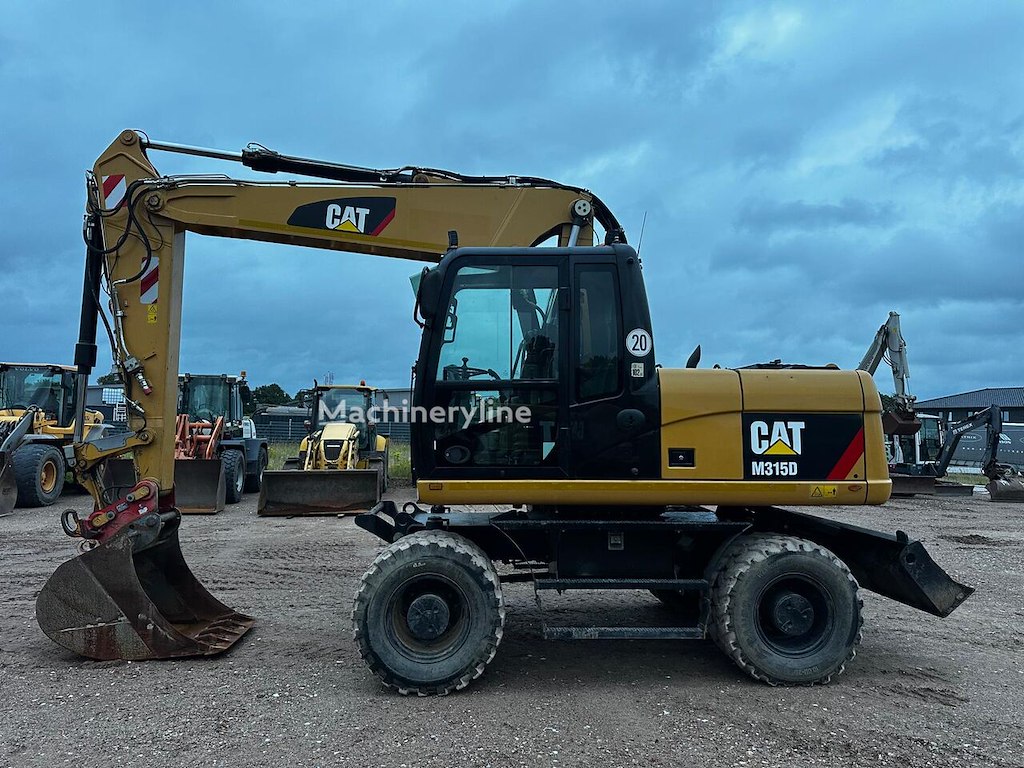 Caterpillar M 315 D bager točkaš