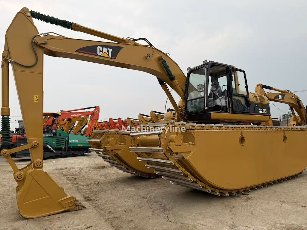 Caterpillar 320CL bager amfibija