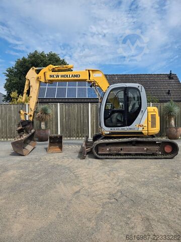 Mini bager
NEW HOLLAND E70SR-1ES
