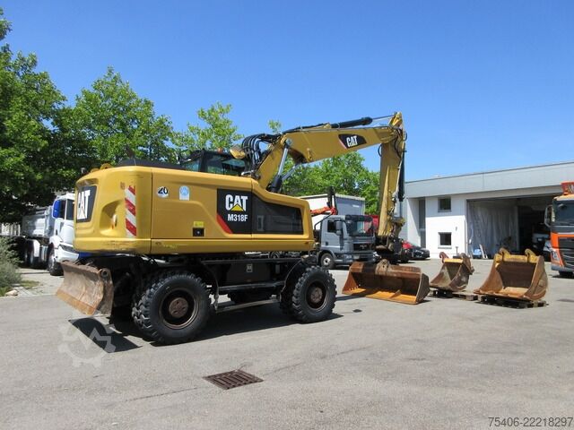 Točkaš bager
caterpillar M 318 F Schnellwechsler, Reifen neu , 3xSchaufel