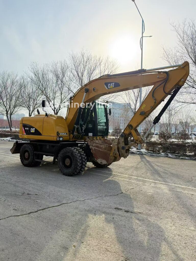 Caterpillar M315D2 bager točkaš