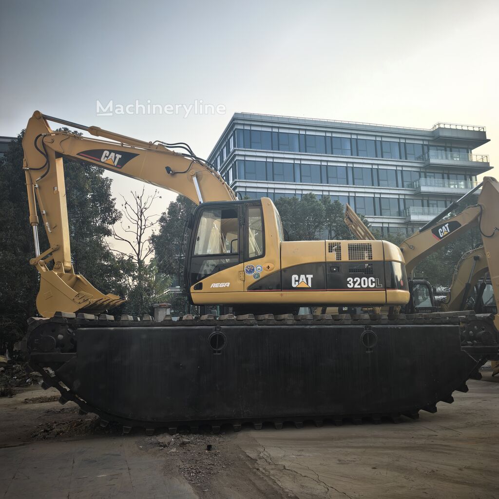 Caterpillar 320CL bager amfibija