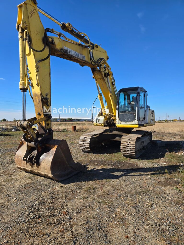 New Holland E245 bager sa dugom strelom