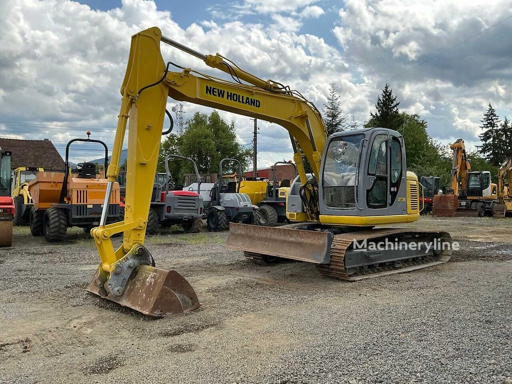 Prodaje se New Holland E 135 bager guseničar na aukciji