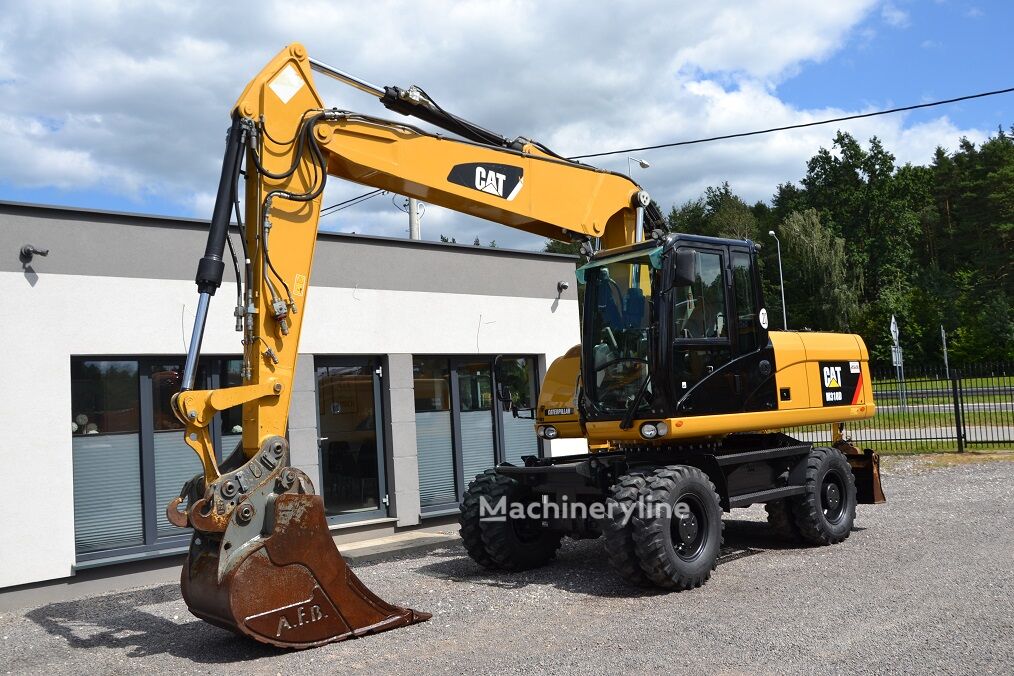 Caterpillar 318 D bager točkaš