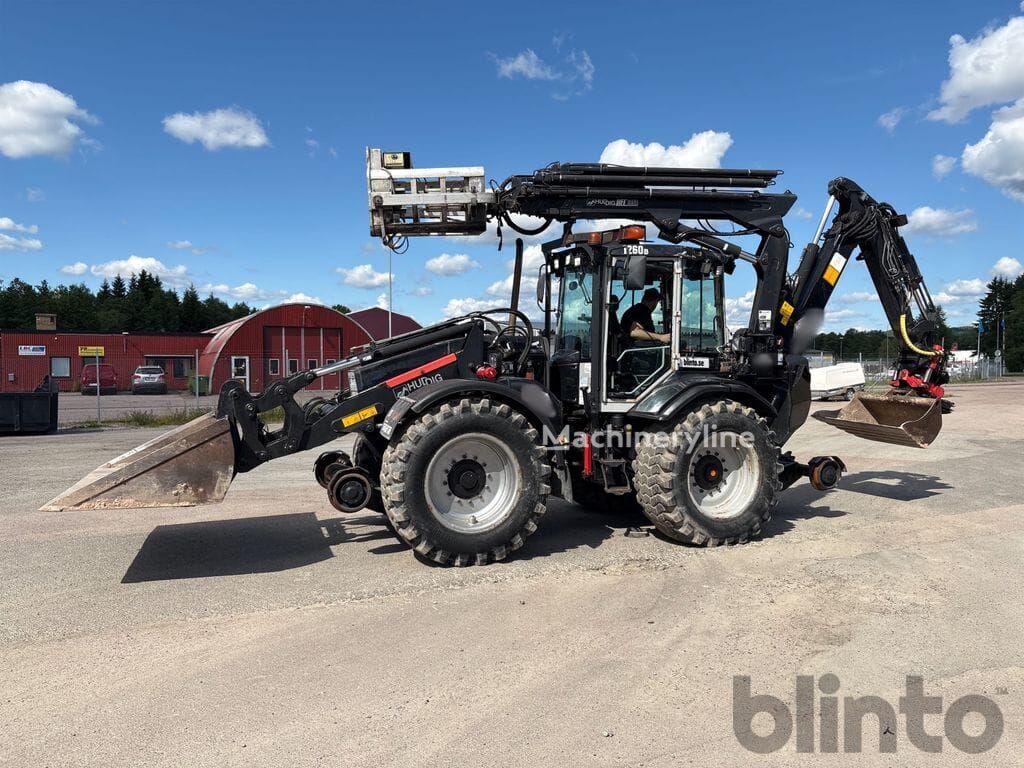 Prodaje se Huddig 1260B bager-utovarivač na aukciji