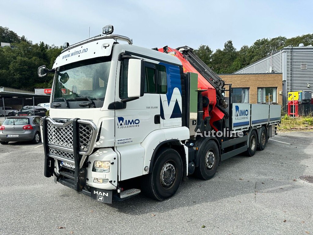 Prodaje se MAN TGS 35.500 8x4 med Palfinger PK78002 kran, PJ125 Jibb og EP860.1 kamion s ravnom platformom na aukciji