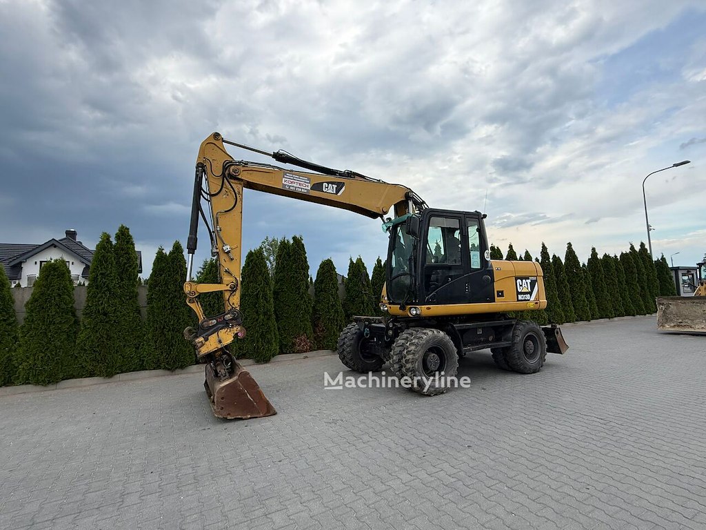 Caterpillar 313 bager točkaš