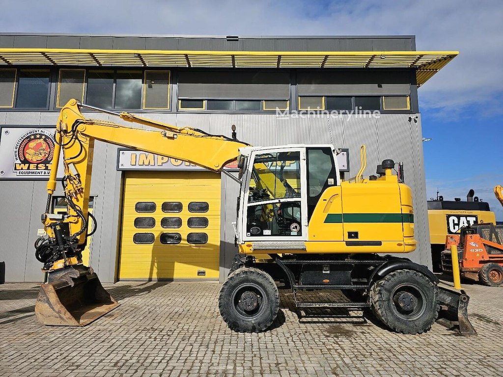 Caterpillar M315 bager točkaš