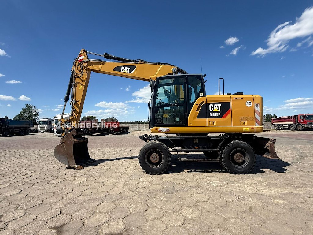 Caterpillar 318 bager točkaš