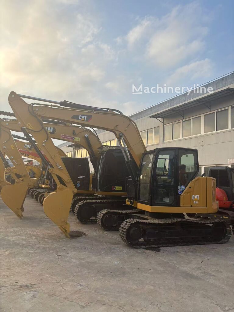 Caterpillar 310 bager guseničar