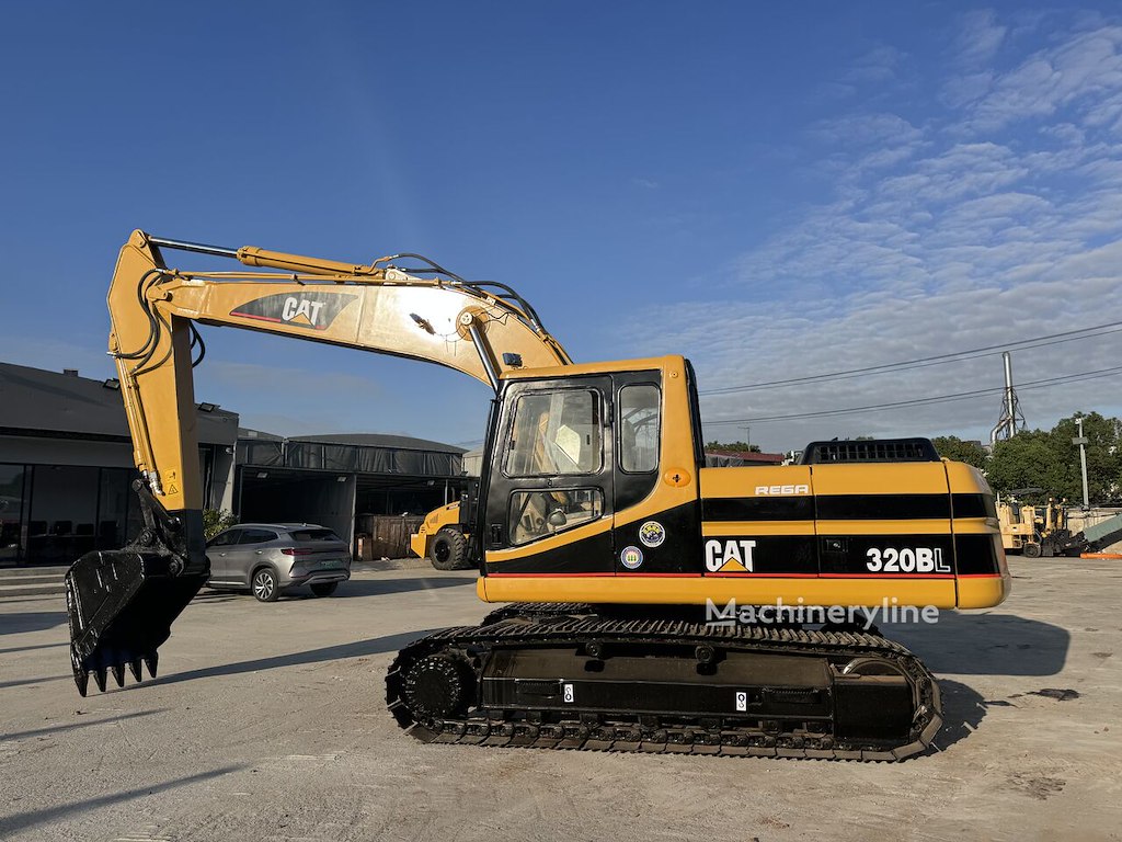 Caterpillar 320BL bager guseničar