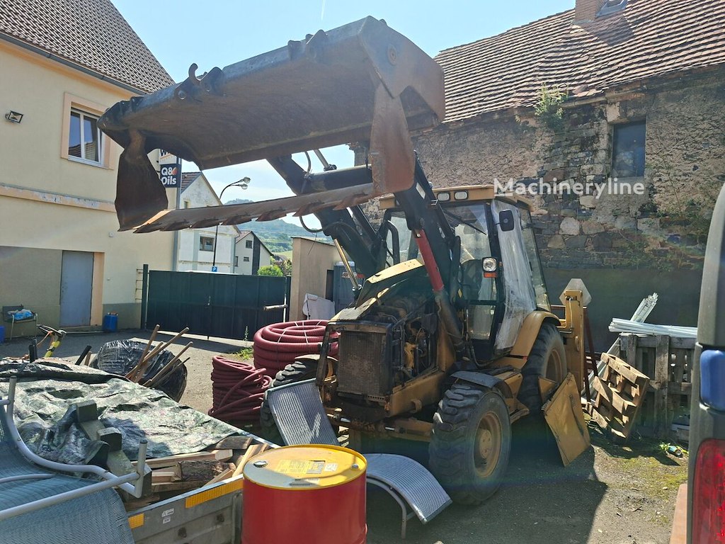 Prodaje se Caterpillar 428 C 4X4 bager-utovarivač na aukciji