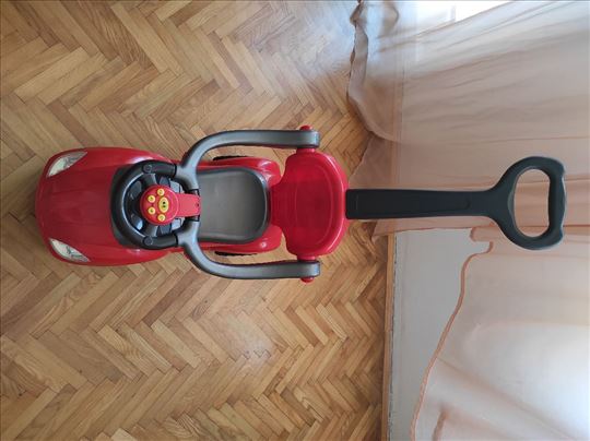 Dečji auto guralica sa ručkom i zvukom – očuvan