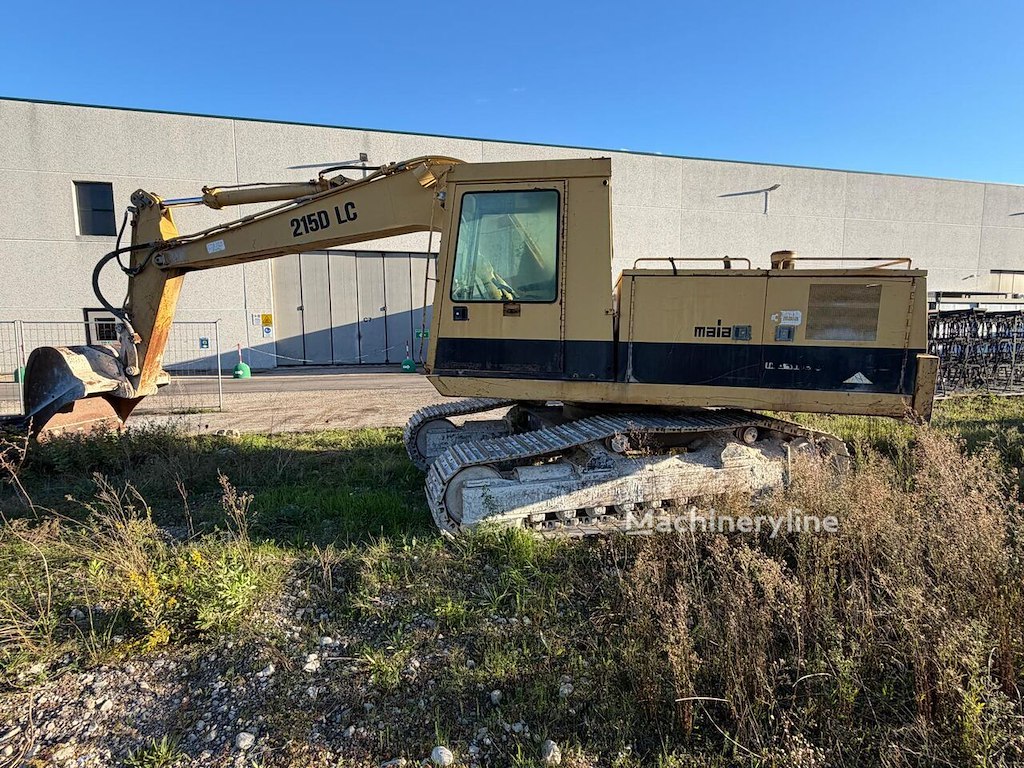 Caterpillar 215D bager guseničar