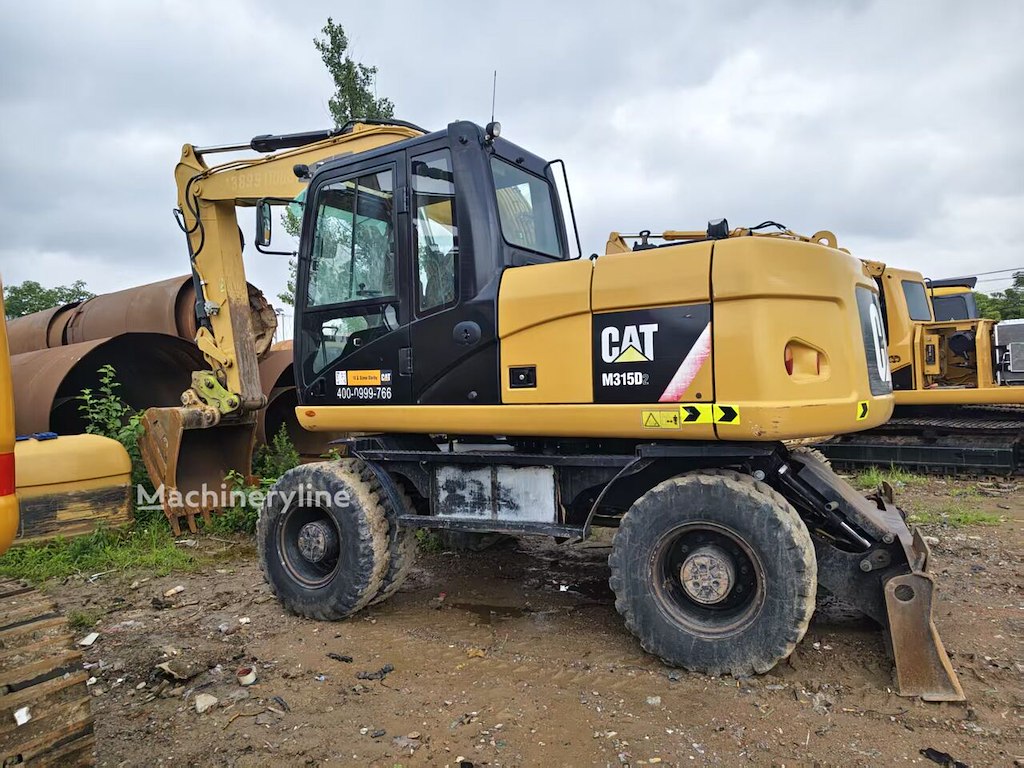 Caterpillar M315D2 bager točkaš