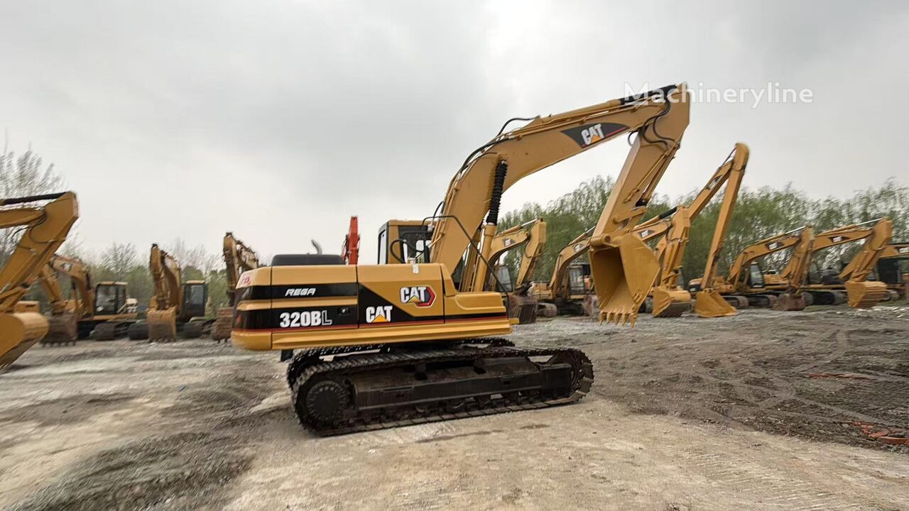 Caterpillar 320BL bager guseničar