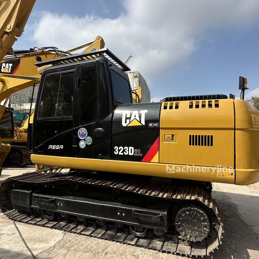 Caterpillar 323DL bager guseničar