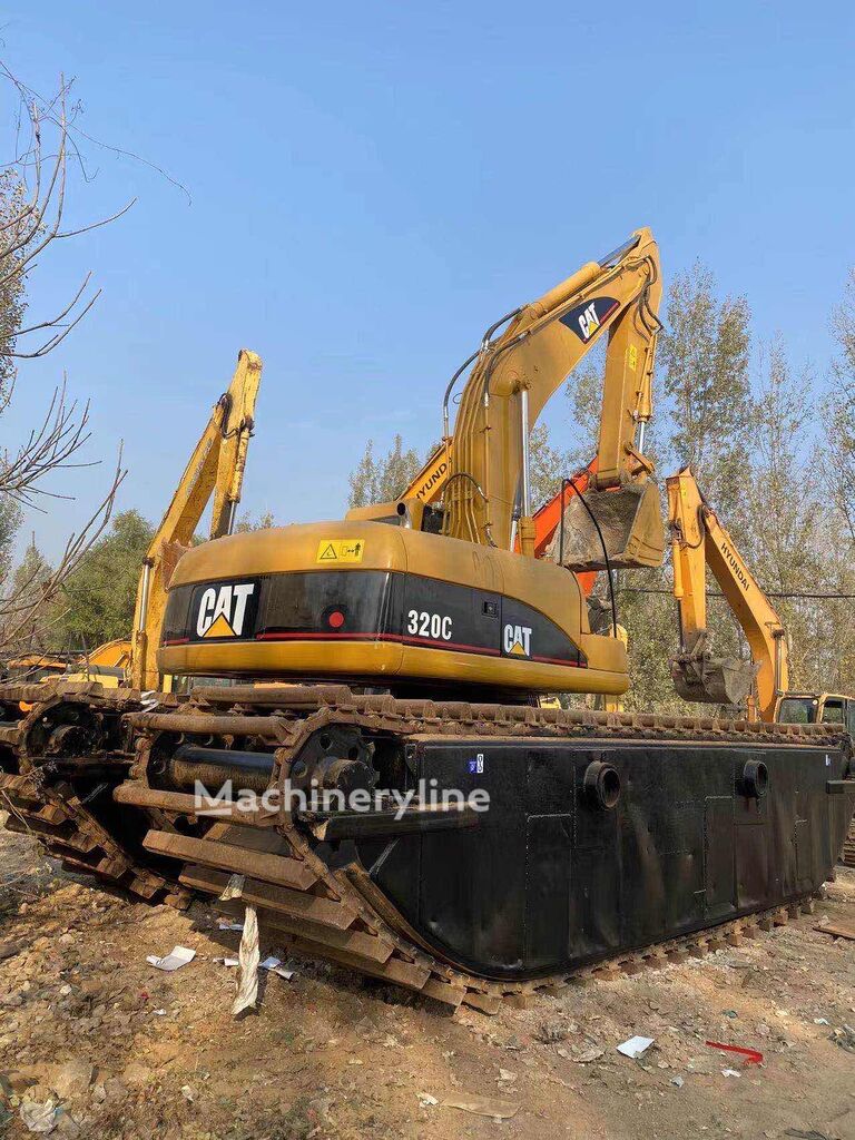 Caterpillar 320C bager amfibija