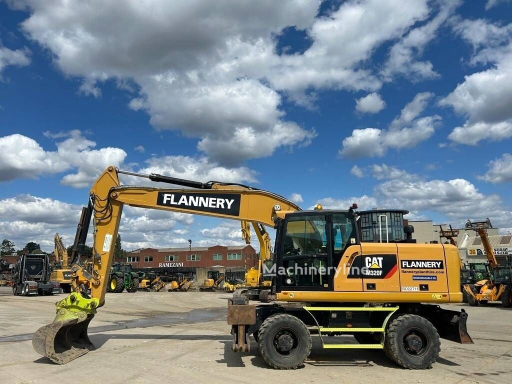 Caterpillar M 320 F bager točkaš