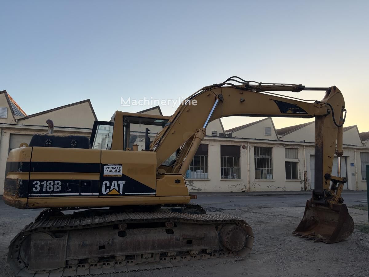 Caterpillar 318BL bager guseničar