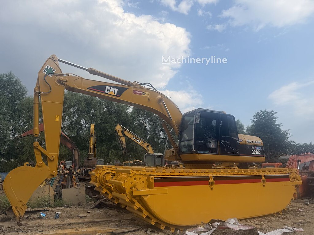Caterpillar 320CL bager amfibija