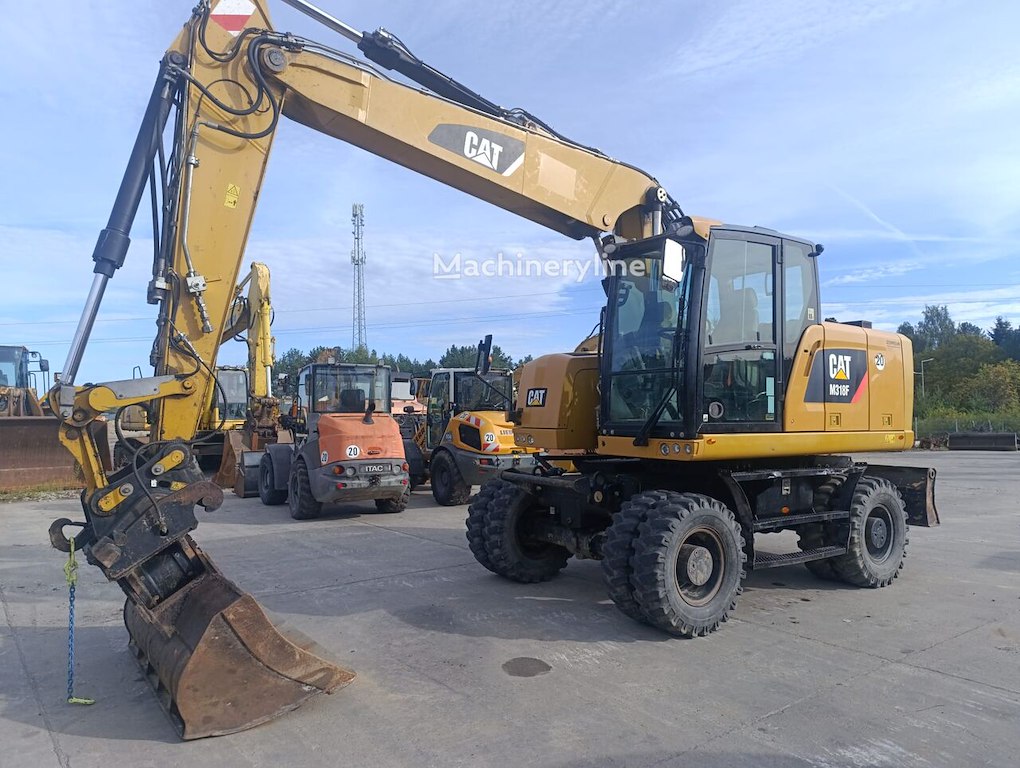 Caterpillar M318 bager točkaš