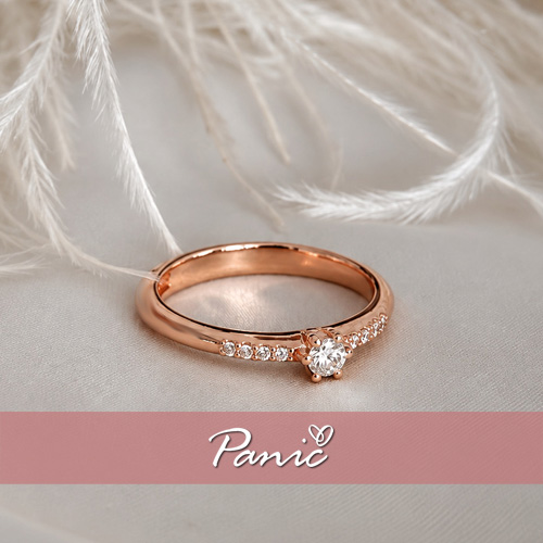 Elegantan verenički prsten od roze zlata sa centralnim brilijantom 0,12ct (VS/GH) i sitnijim 8x0,005ct (VS/GH) sa strane