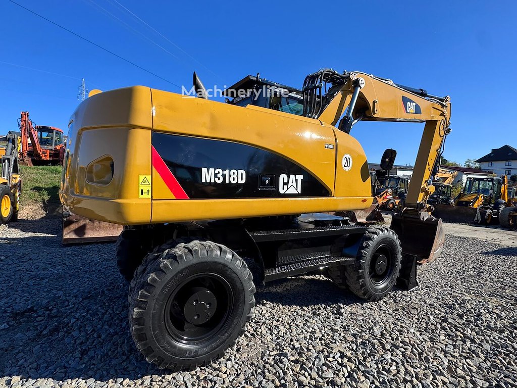 Caterpillar M318 bager točkaš